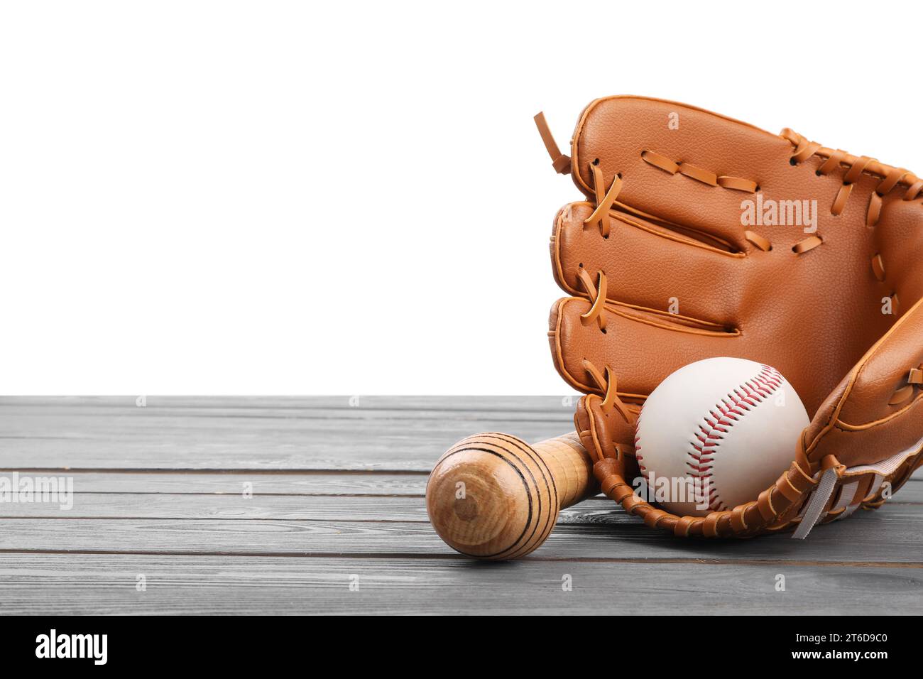 Baseball bat, ball and catcher's mitt on grey wooden table against ...