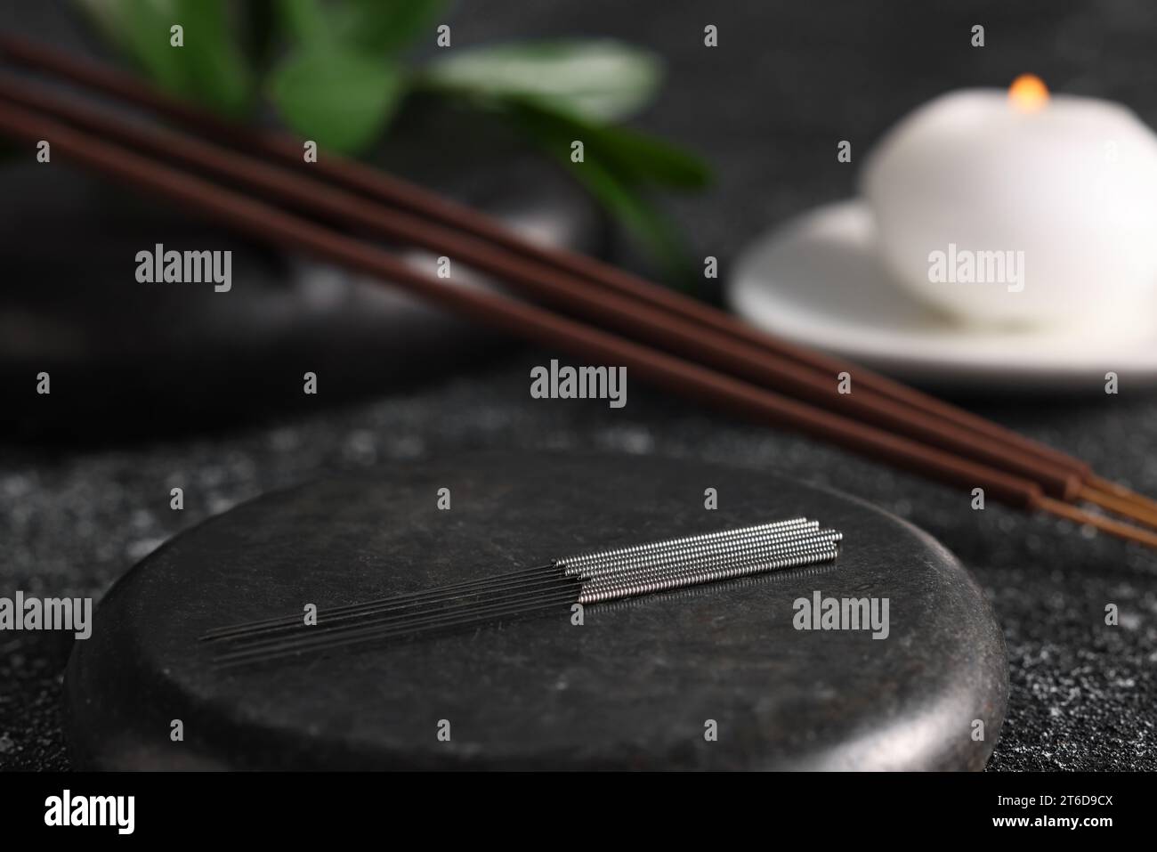 Acupuncture needle on black stone hi-res stock photography and images ...