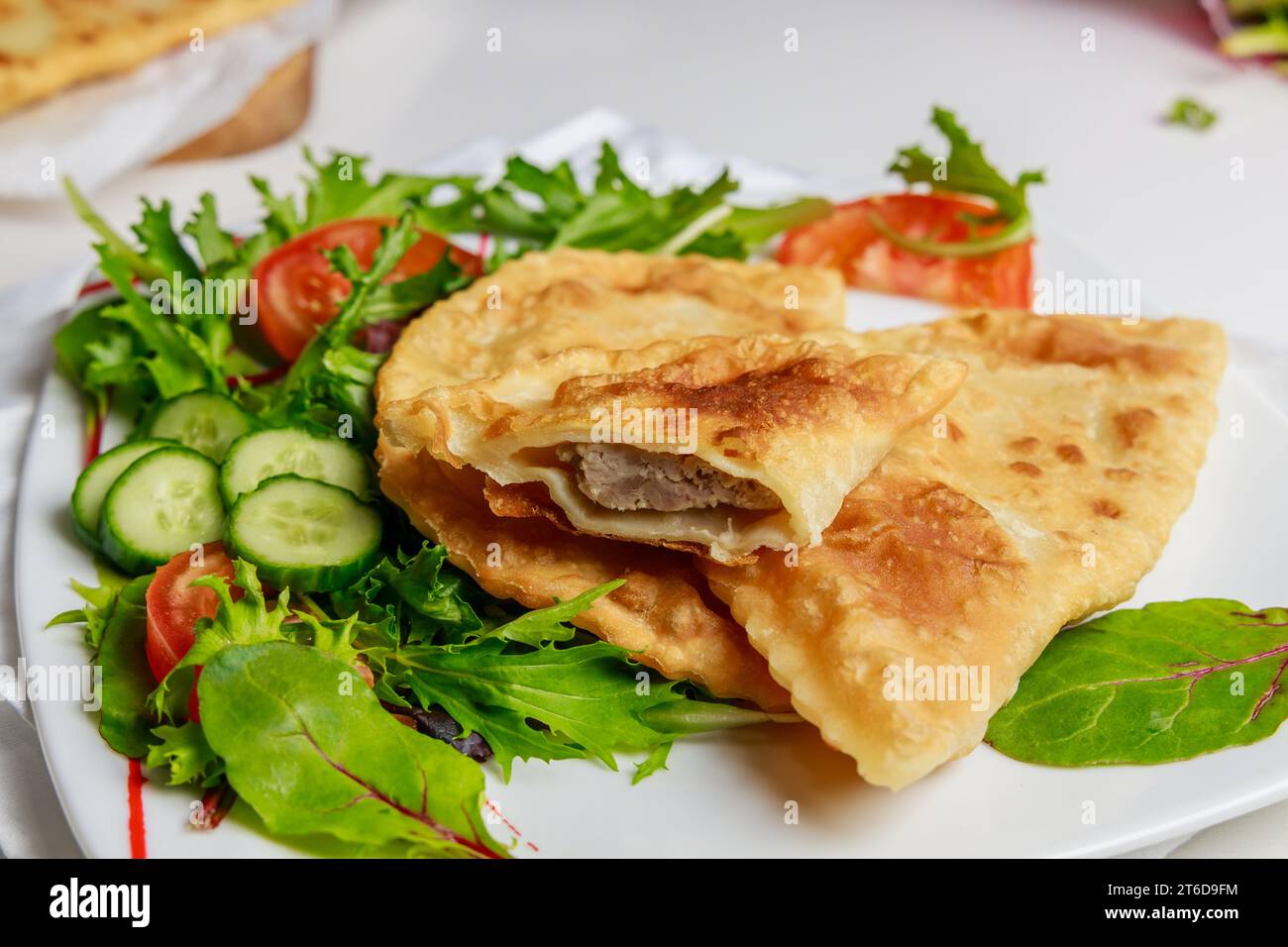Turkish cuisine is chebureki fried dough with meat Stock Photo - Alamy