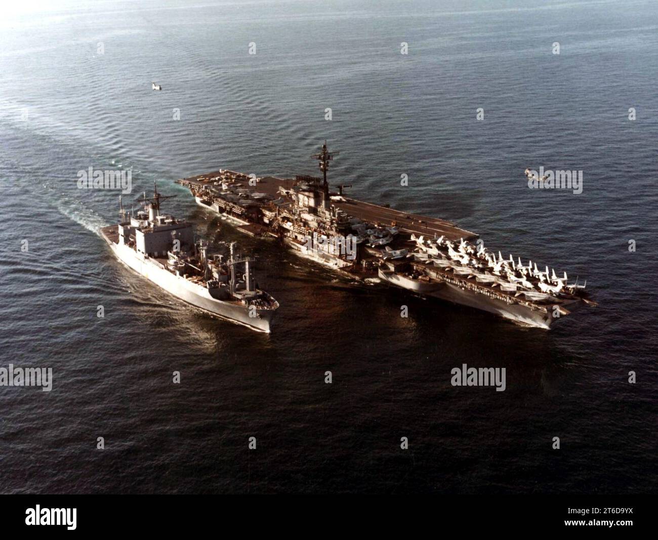 USS Coral Sea (CV-43) with ammunition ship in 1980 Stock Photo - Alamy