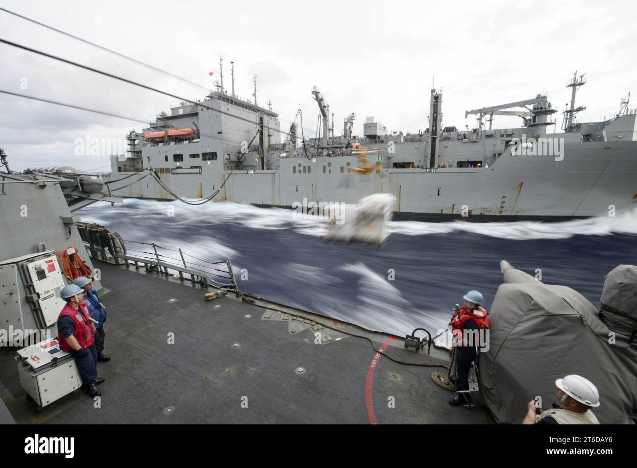 USS Curtis Wilbur conducts a replenishment with USNS Matthew Perry ...