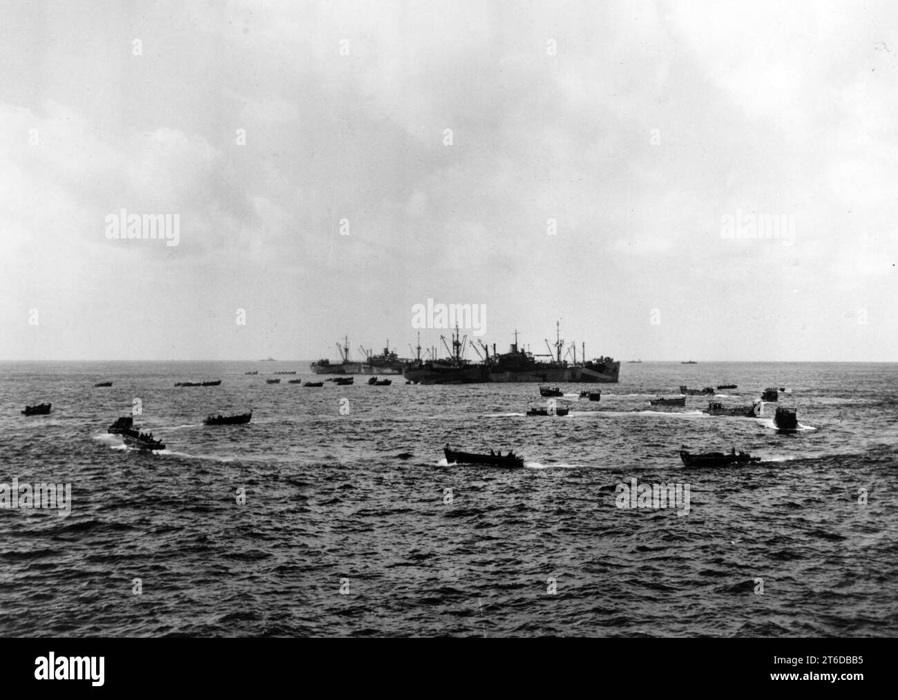 USS Darke (APA-159) with landing craft off Iwo Jima, 19 February 1945 ...