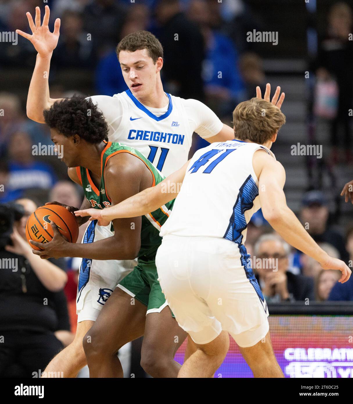 Creighton's Ryan Kalkbrenner, center, and Isaac Traudt, right, defend ...