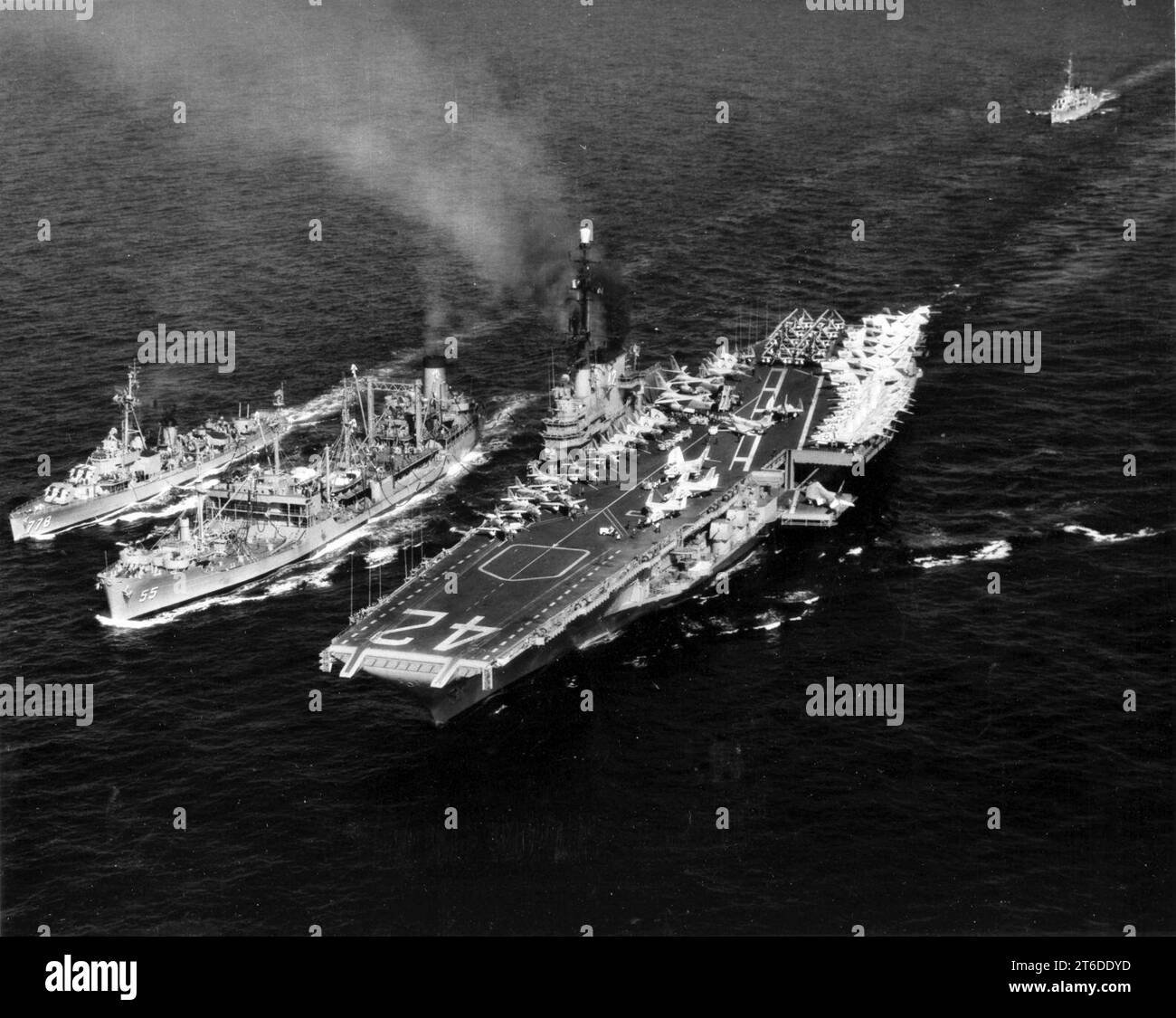 USS Elokomin (AO-55) refuels USS Franklin D. Roosevelt (CVA-42) and USS ...