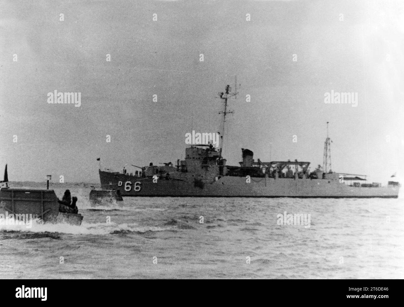 USS Enright (APD-66) operating with landing craft, circa in early 1946 ...