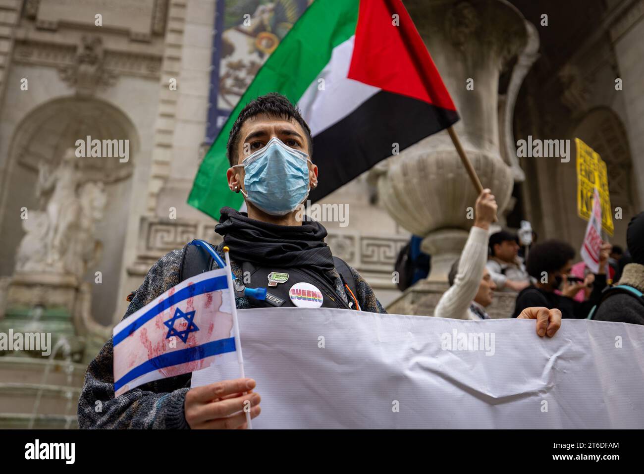 NEW YORK, NEW YORK - NOVEMBER 9: A protester holds an Israeli flag ...