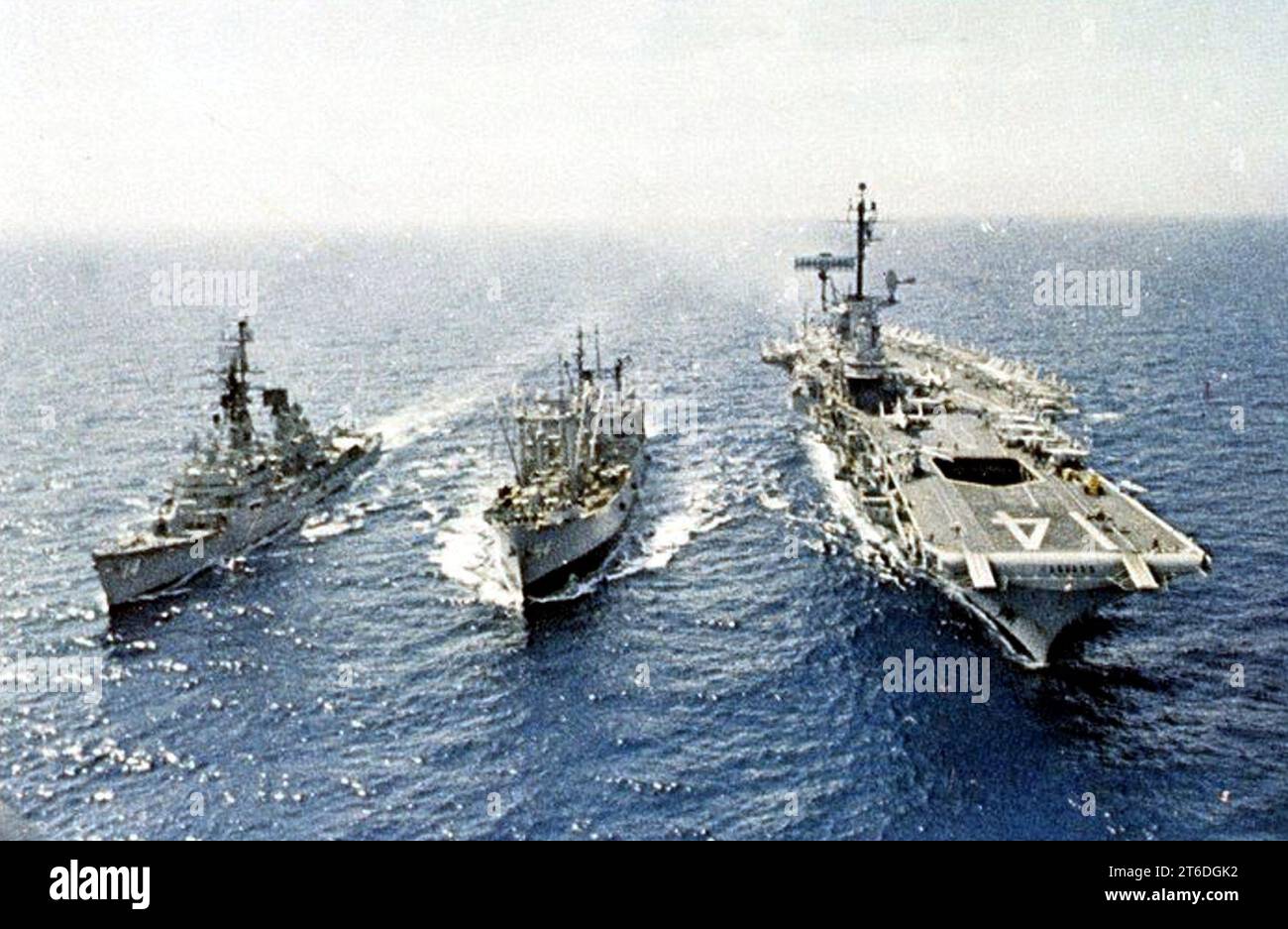 USS Firedrake (AE-14) replenishes USS Ticonderoga (CV-14) and USS ...