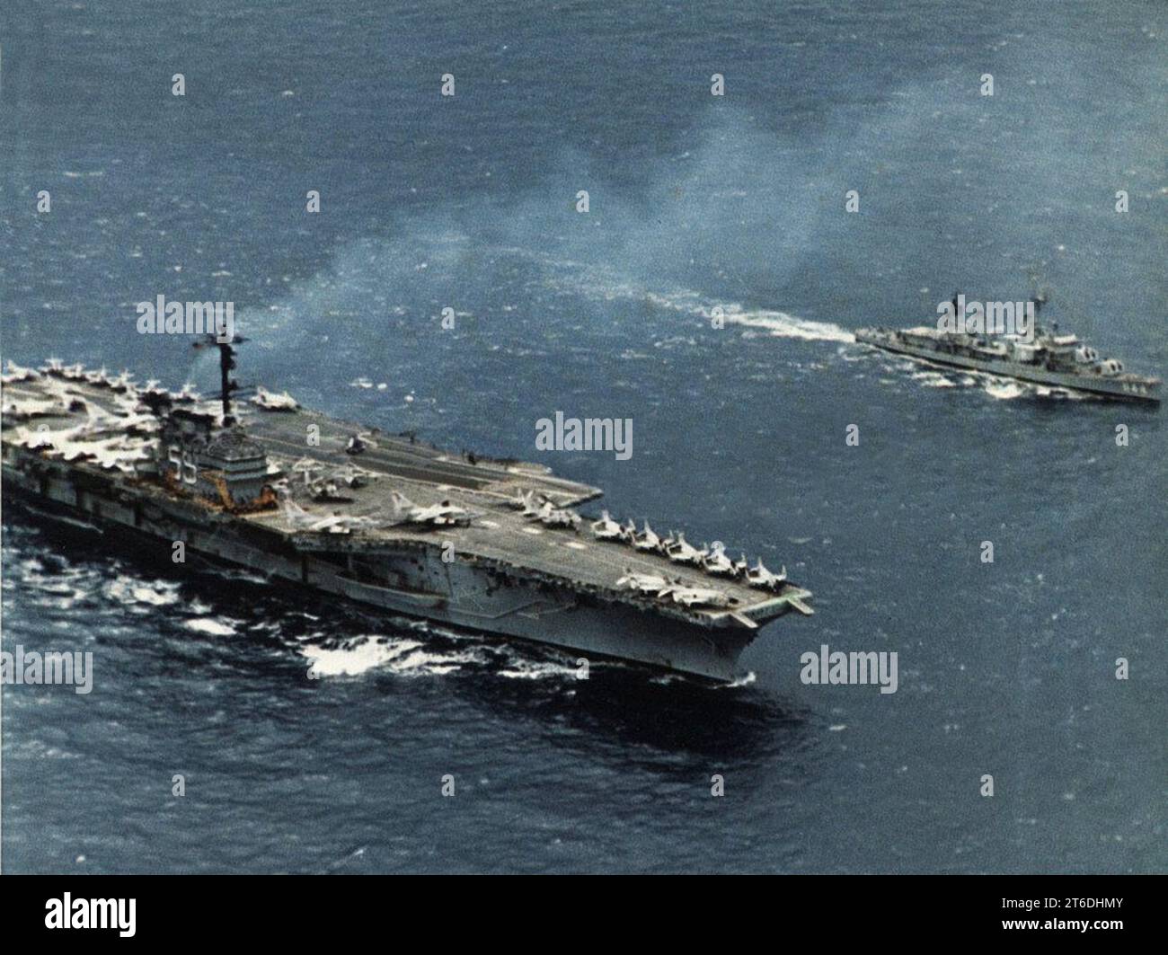 USS Forrestal (CVA-59) and USS Perry (DD-844) underway in 1967 Stock ...