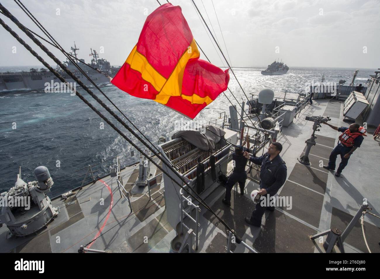 USS Fort McHenry hoists a Romeo flag during an underway replenishment ...