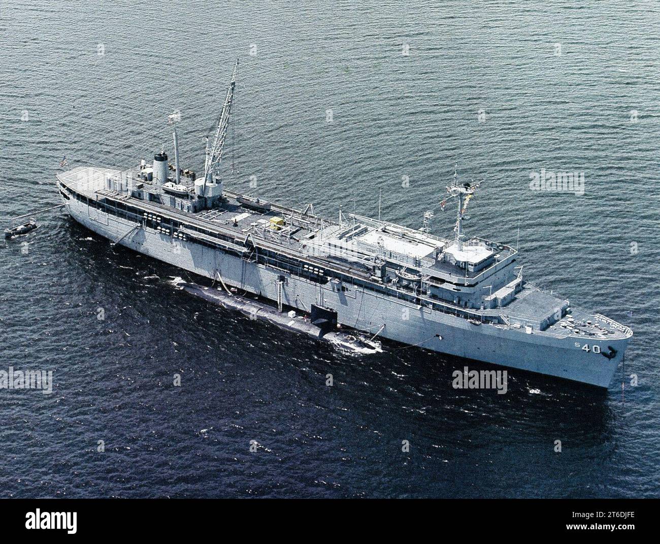USS Frank Cable (AS-40) at anchor, with a Sturgeon class nuclear ...