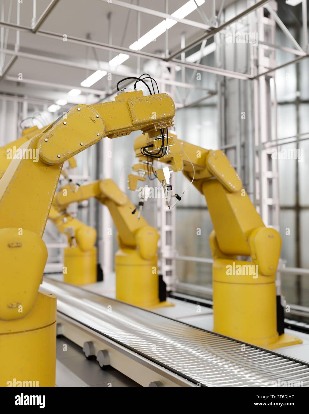 Yellow robot arms in a production line over a conveyor belt in a modern factory. Automated ...