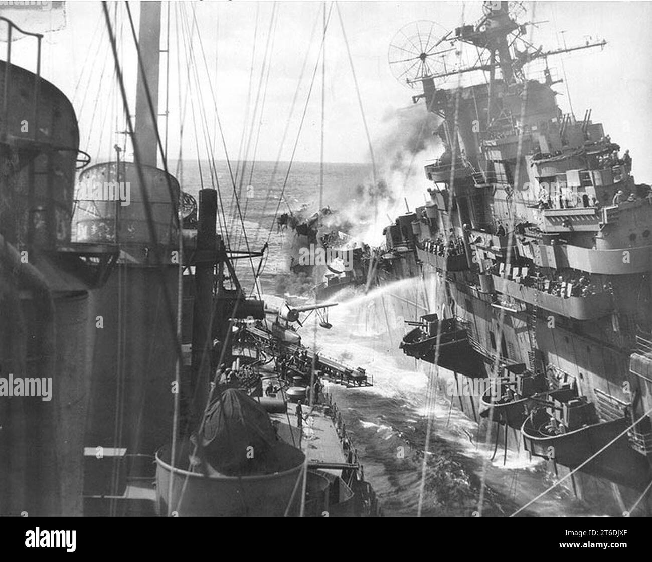 USS Franklin (CV-13) burning, 19 March 1945, seen from USS Santa Fe (CL ...