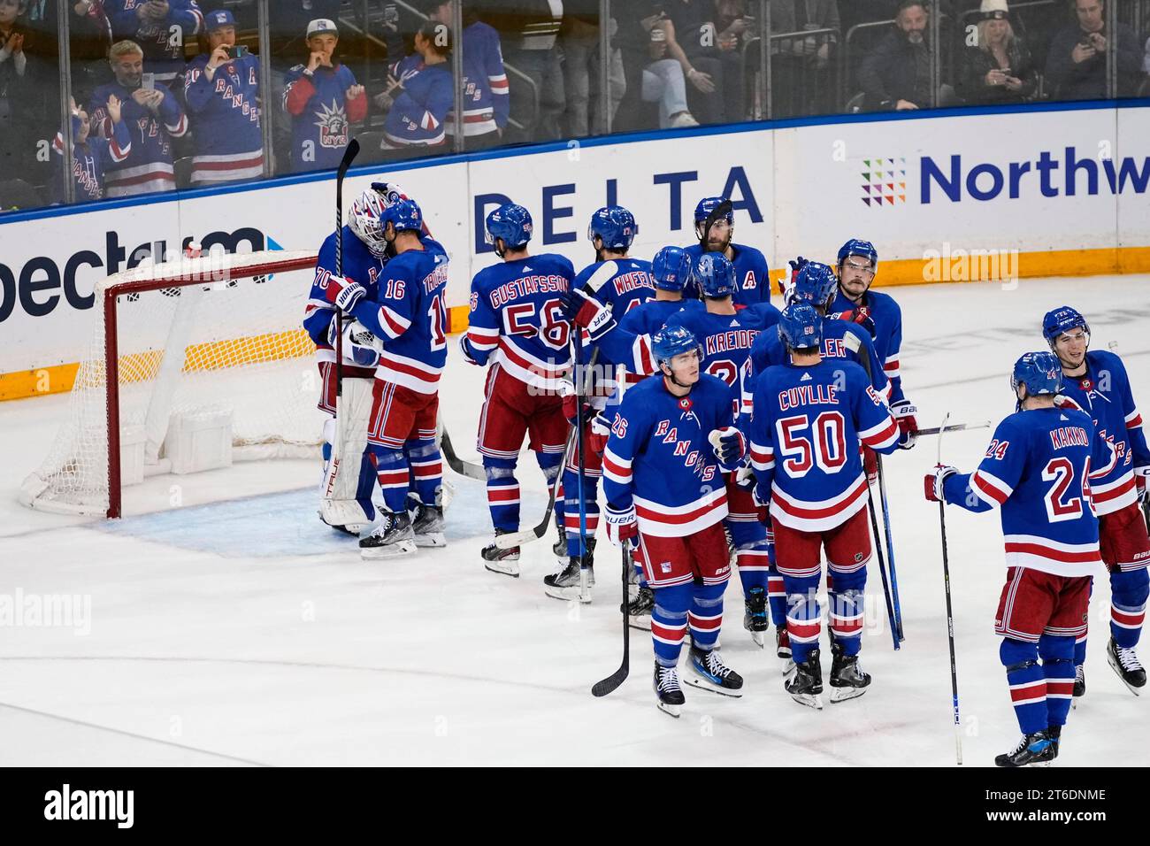 New York Rangers goaltender Louis Domingue, left, celebrates with ...