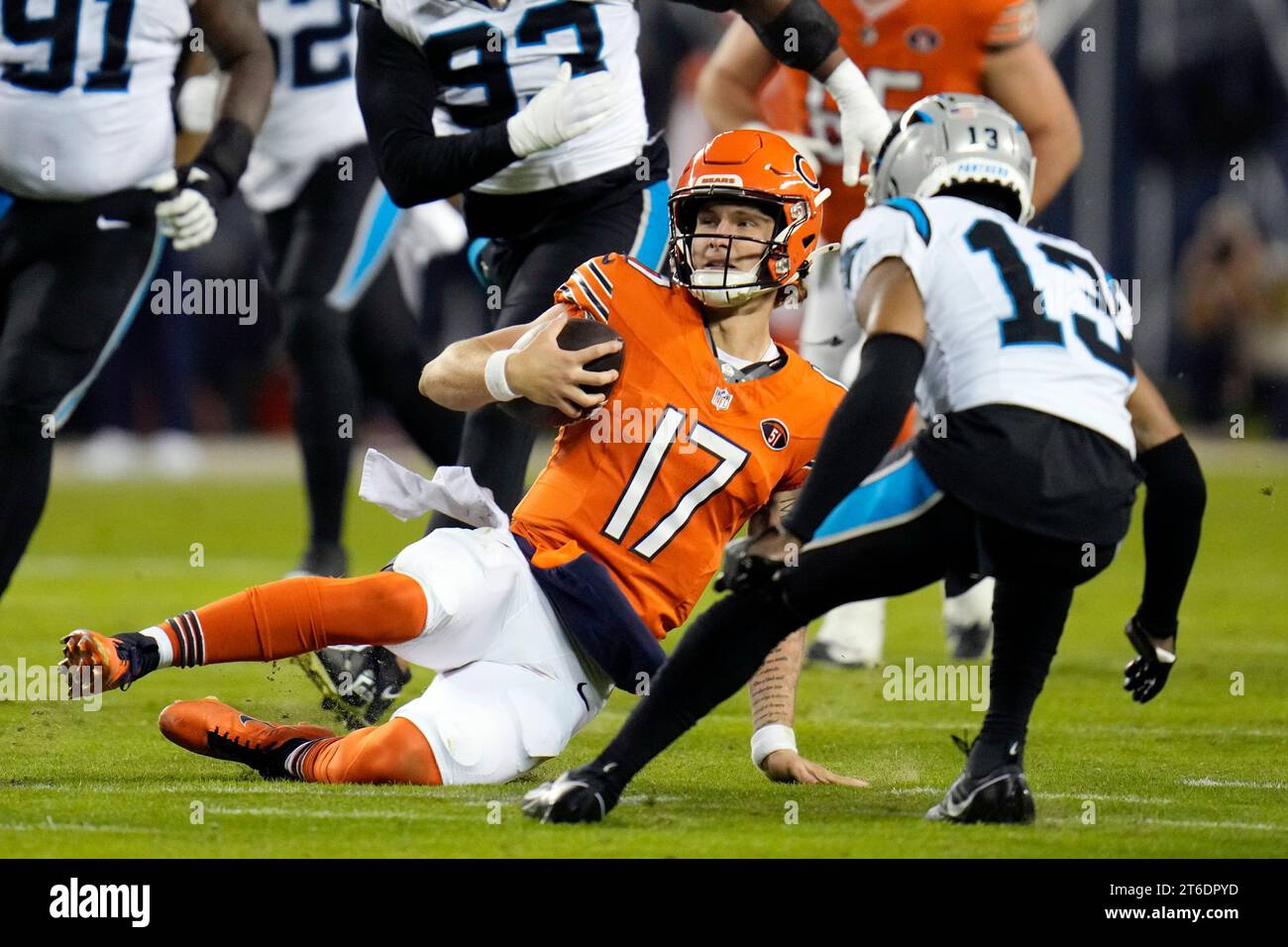 Chicago Bears quarterback Tyson Bagent (17) slides behind Carolina ...