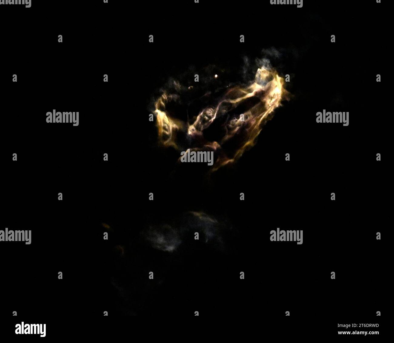 Exhaust plume is illuminated as the SpaceX Falcon 9 rocket stage ...