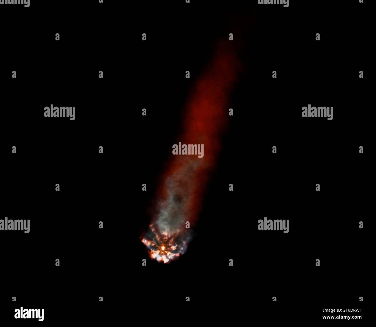 Exhaust plume turns red at altitude as the SpaceX Falcon 9 rocket ...