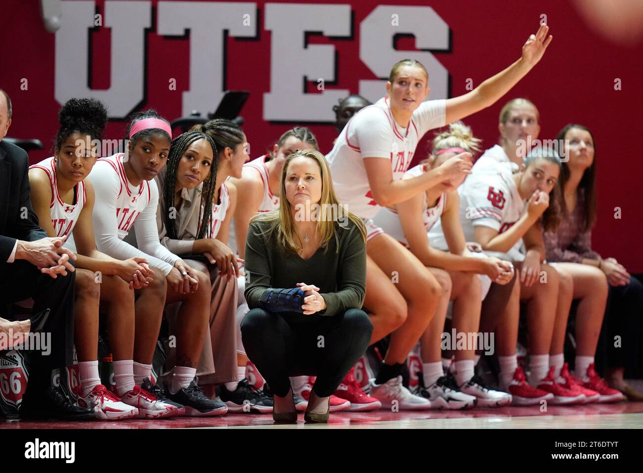 Utah head coach Lynne Roberts, center, looks on during the first half ...