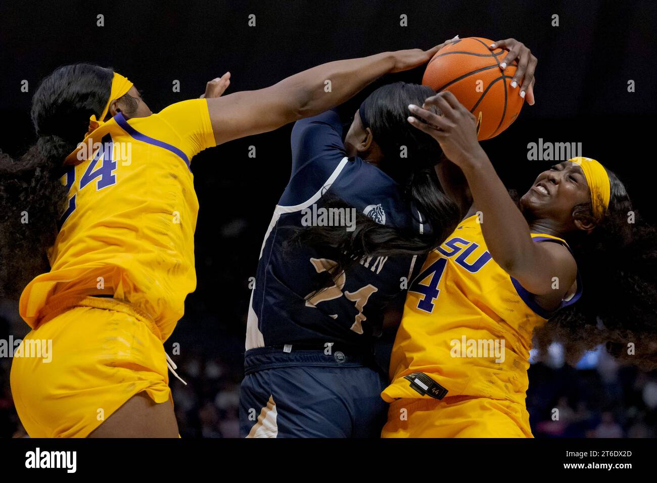 LSU guards Aneesah Morrow (24) and Flau'jae Johnson (4) block a shot by ...