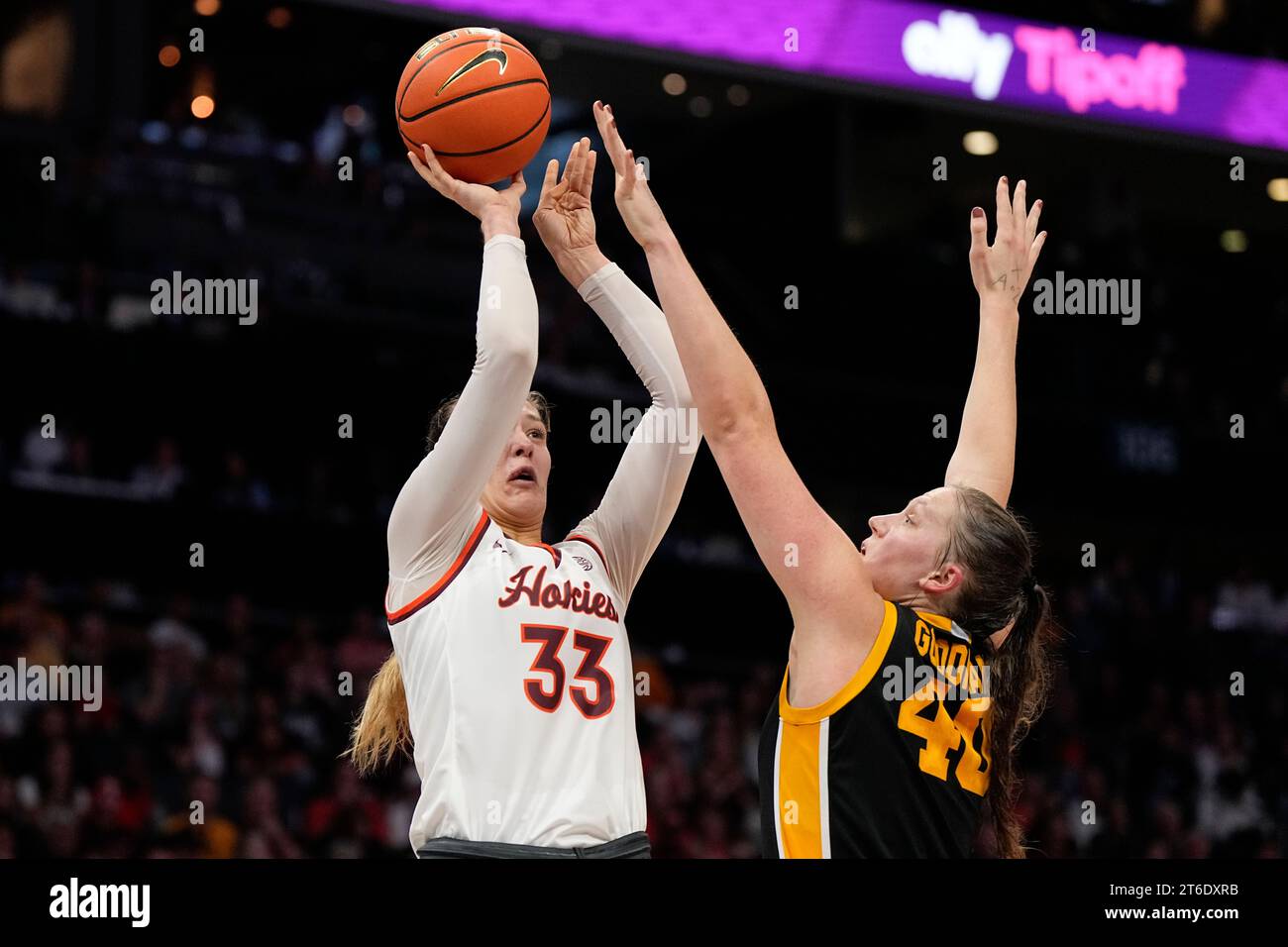 Virginia Tech center Elizabeth Kitley shoots over Iowa center Sharon ...