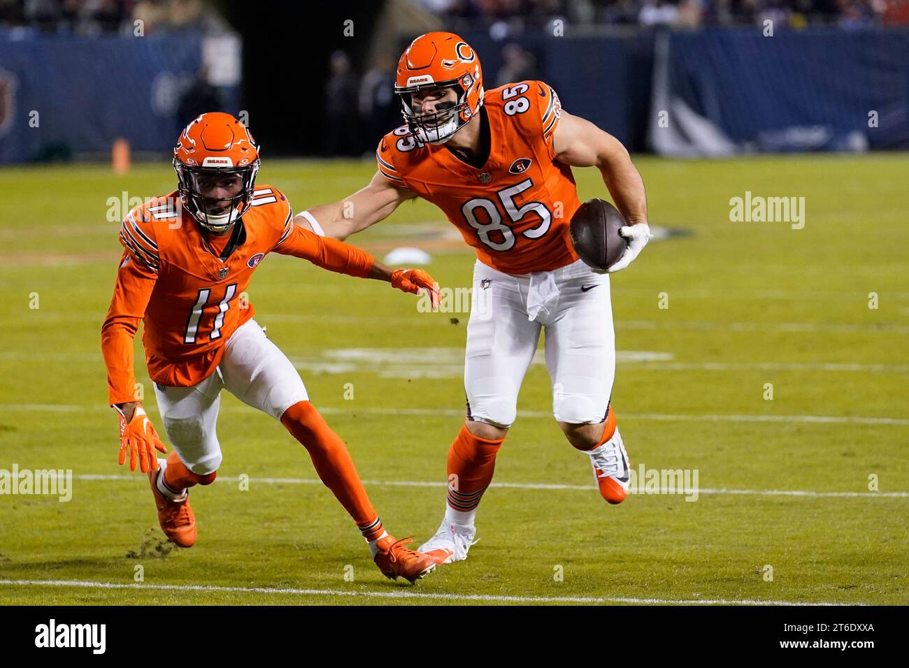 Chicago Bears tight end Cole Kmet (85) runs behind the block from wide ...
