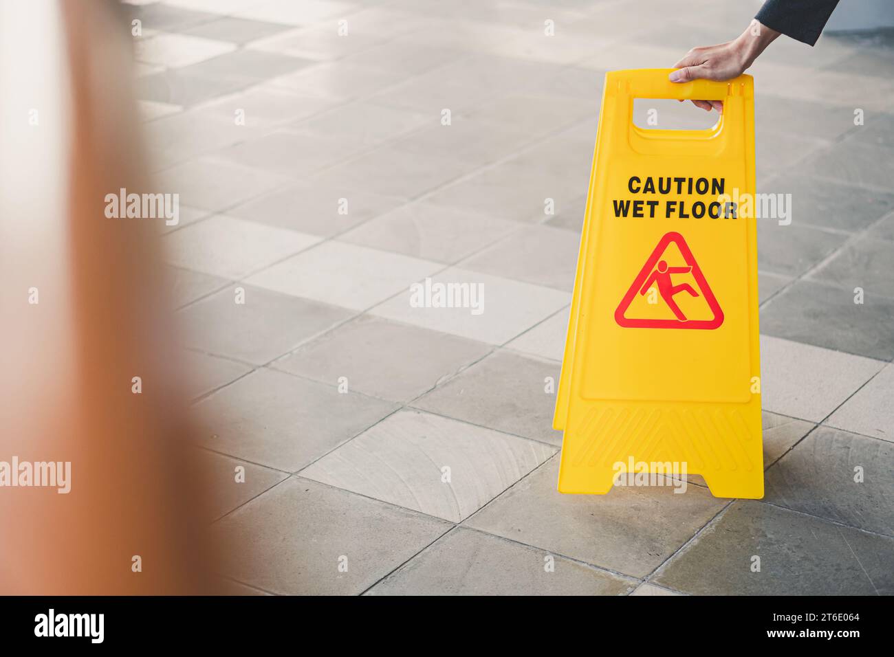cleaning in progress sign on yellow plastic board on floor Stock Photo ...
