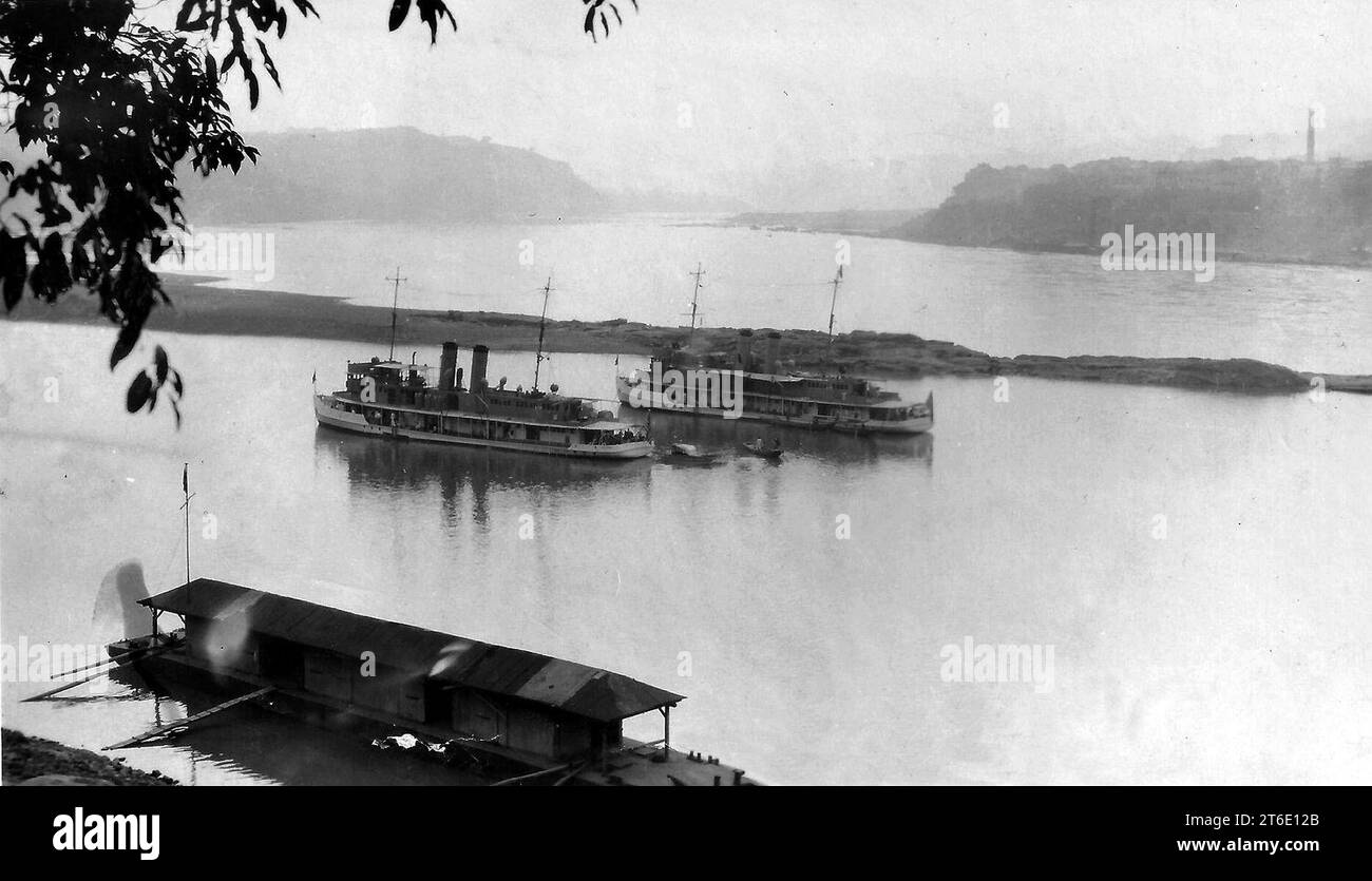 USS Guam (PR-3) and USS Tutuila (PR-4) at anchor at Lung men Hao, China ...
