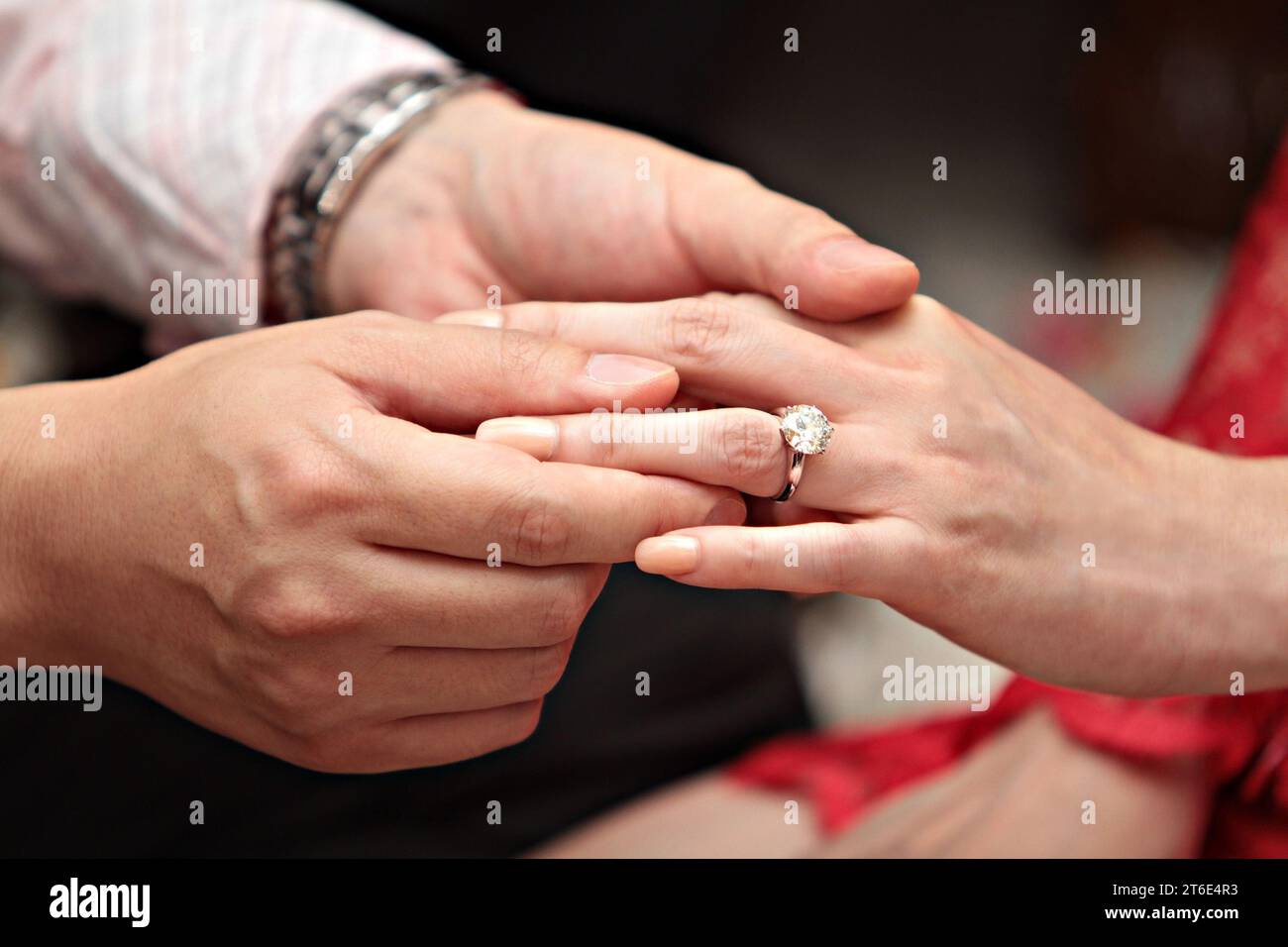 Man giving an engagement ring to his girlfriend Stock Photo - Alamy