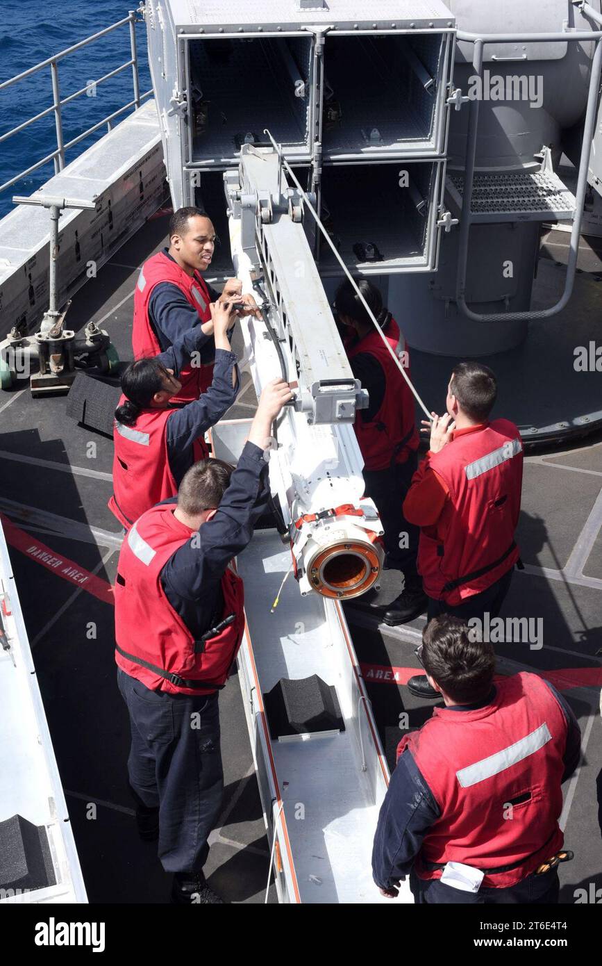 USS Harry S. Truman (CVN 75) sailors load a missile into a NATO Sea ...