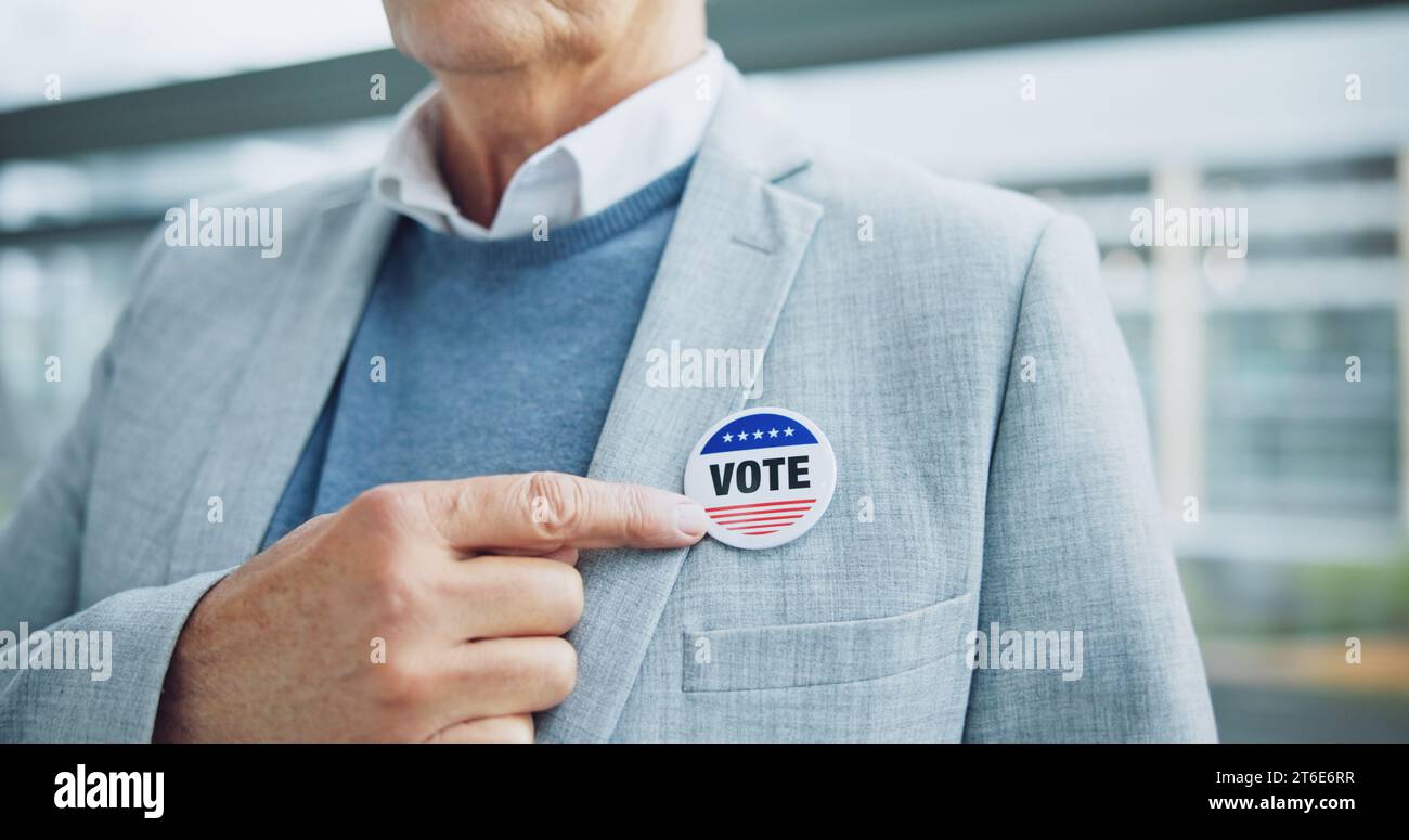 Man, hand and election vote sticker for president party cast, poll ...