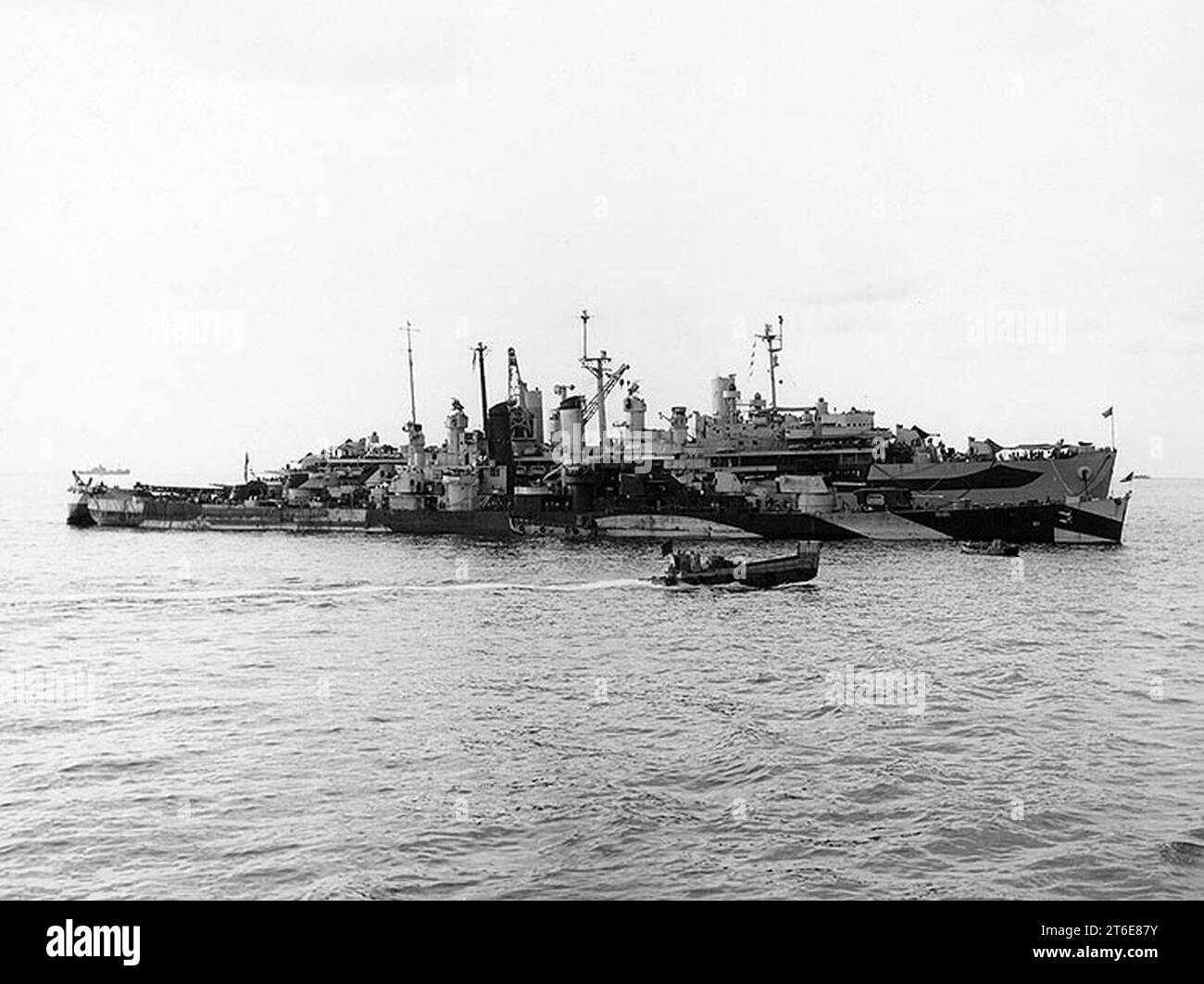 USS Houston (CL-81) alongside USS Hector (AR-7) at Ulithi in November ...