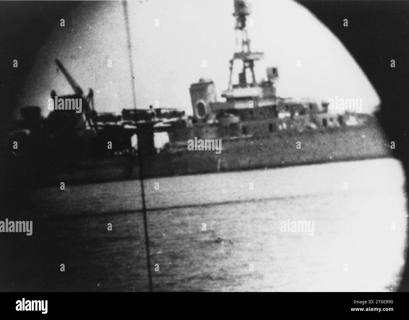 USS Houston (CA-30) seen through the sight of an Australian 102 mm gun ...