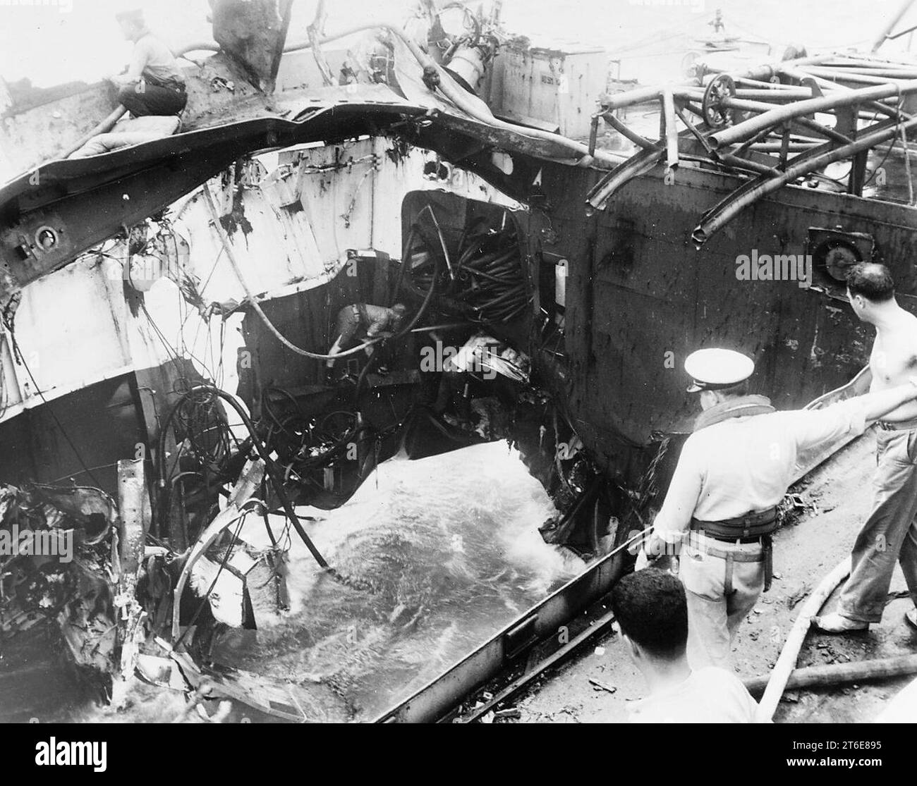USS Houston (CL-81) showing torpedo damage inflicted during the Formosa ...