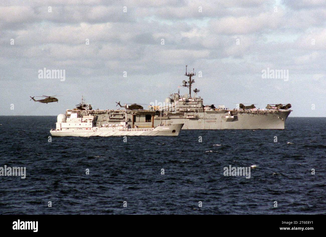 USS Inchon (LPH-12) with East German SIGINT ship Jasmund 1986 Stock ...