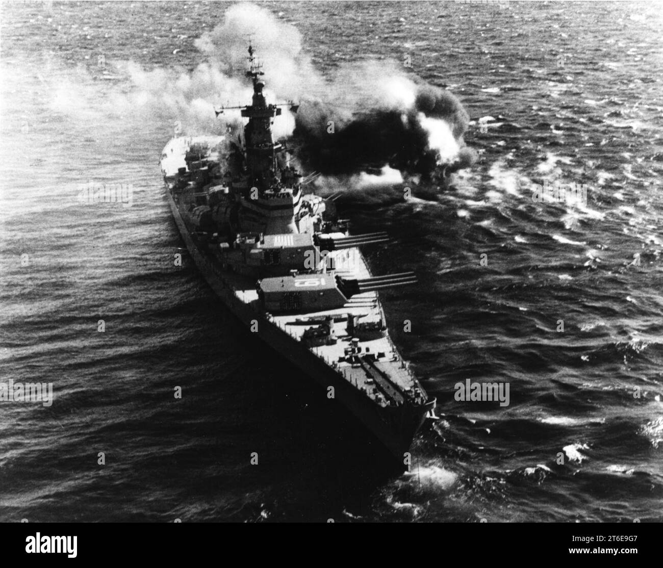 USS Iowa (BB-61) firing her 406 mm guns at North Korean coastal ...