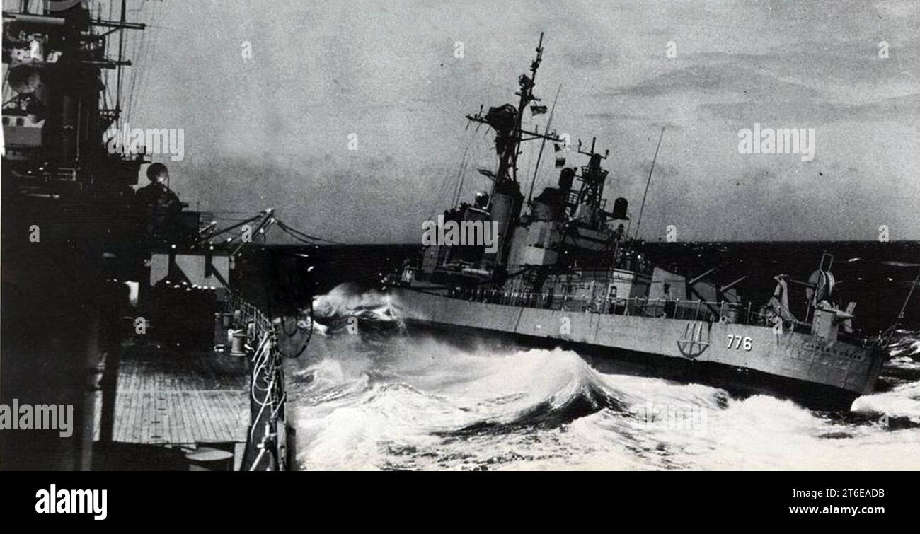 USS James C. Owens (DD-776) refuels from USS Newport News (CA-148), in ...