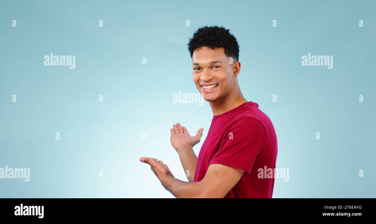 Portrait, happy man and smile with presentation in studio for promotion ...