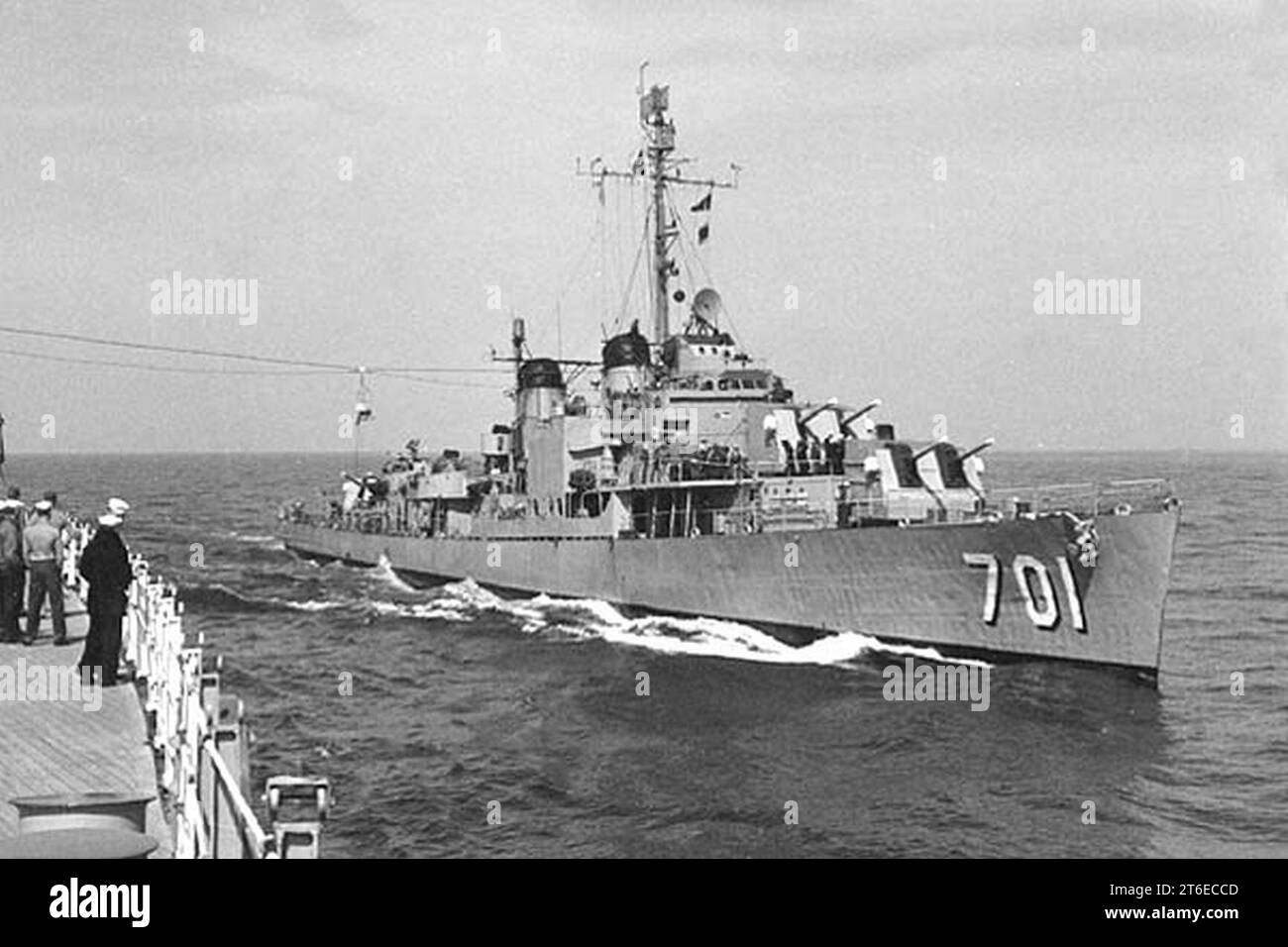 USS John W. Weeks (DD-701) during a highline transfer with USS ...