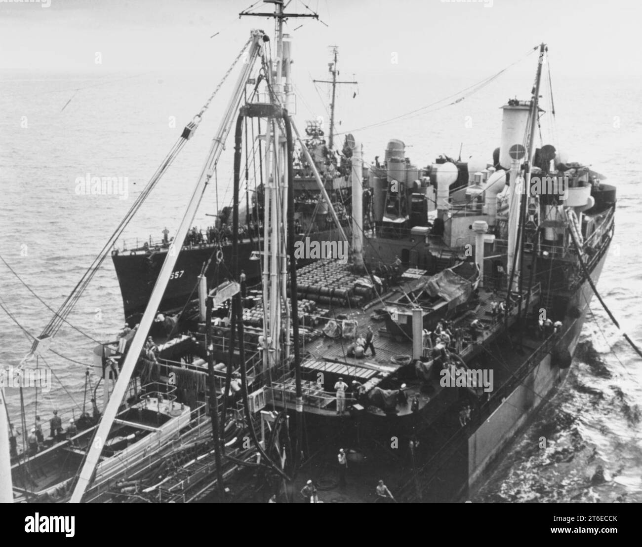 USS Johnston (DD-557) refueling from USS Millicoma (AO-73) in August ...