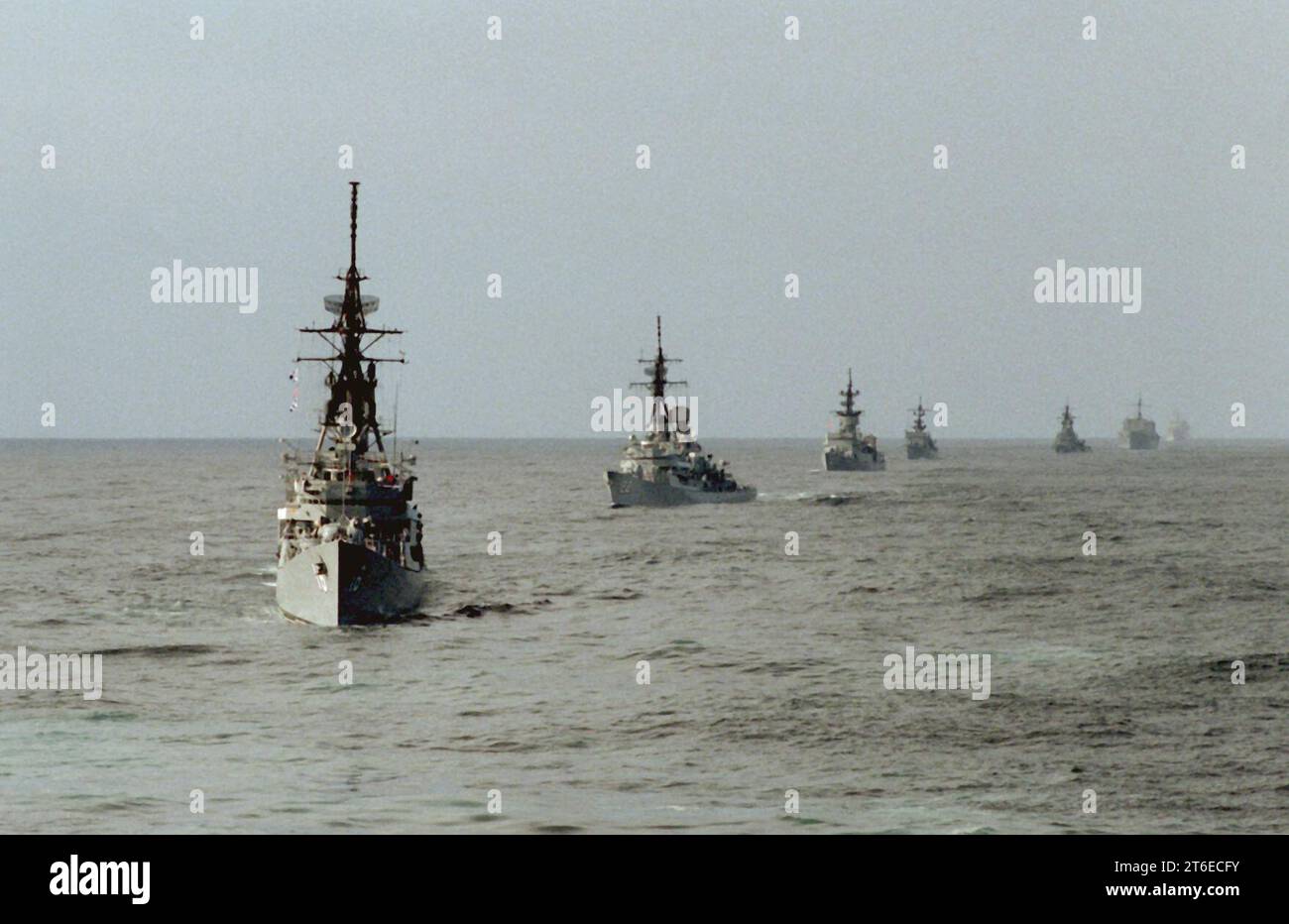 USS Joseph Strauss (DDG-16) leads a line of ships Stock Photo - Alamy
