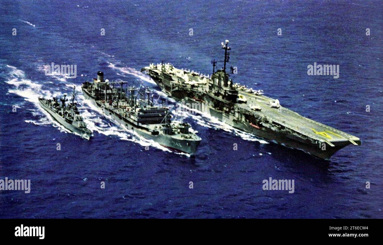 USS Kawishiwi (AO-146) refueling Ticonderoga (CVA-14) and Rogers (DD ...