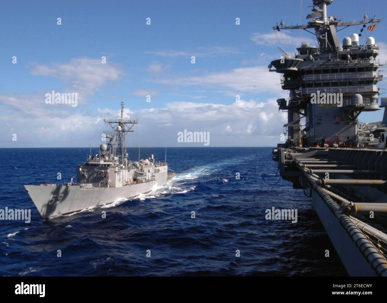 USS Kauffman (FFG-59) alongside USS George Washington (CVN-73) during ...