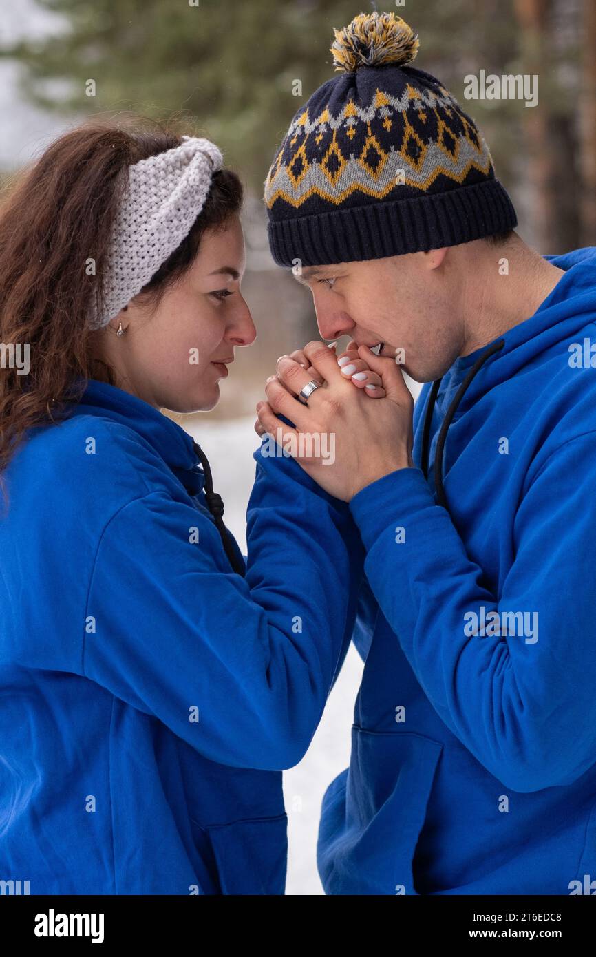 Outdoor happy couple in love posing in cold winter weather Stock Photo ...