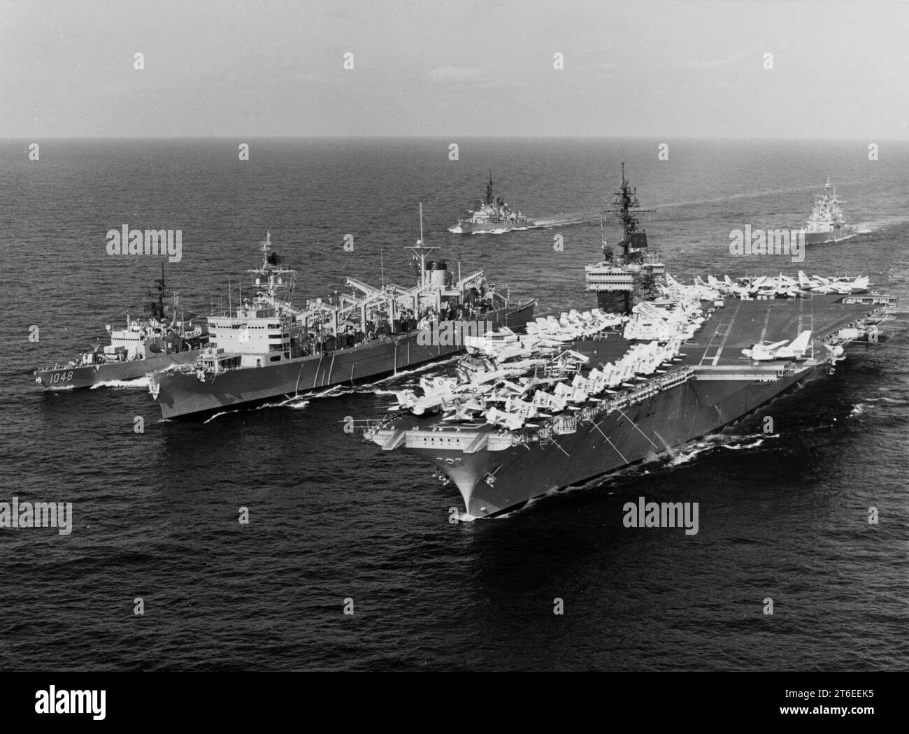 USS Kitty Hawk (CV-63) and USS Sample (FF-1048) refueling from USS ...