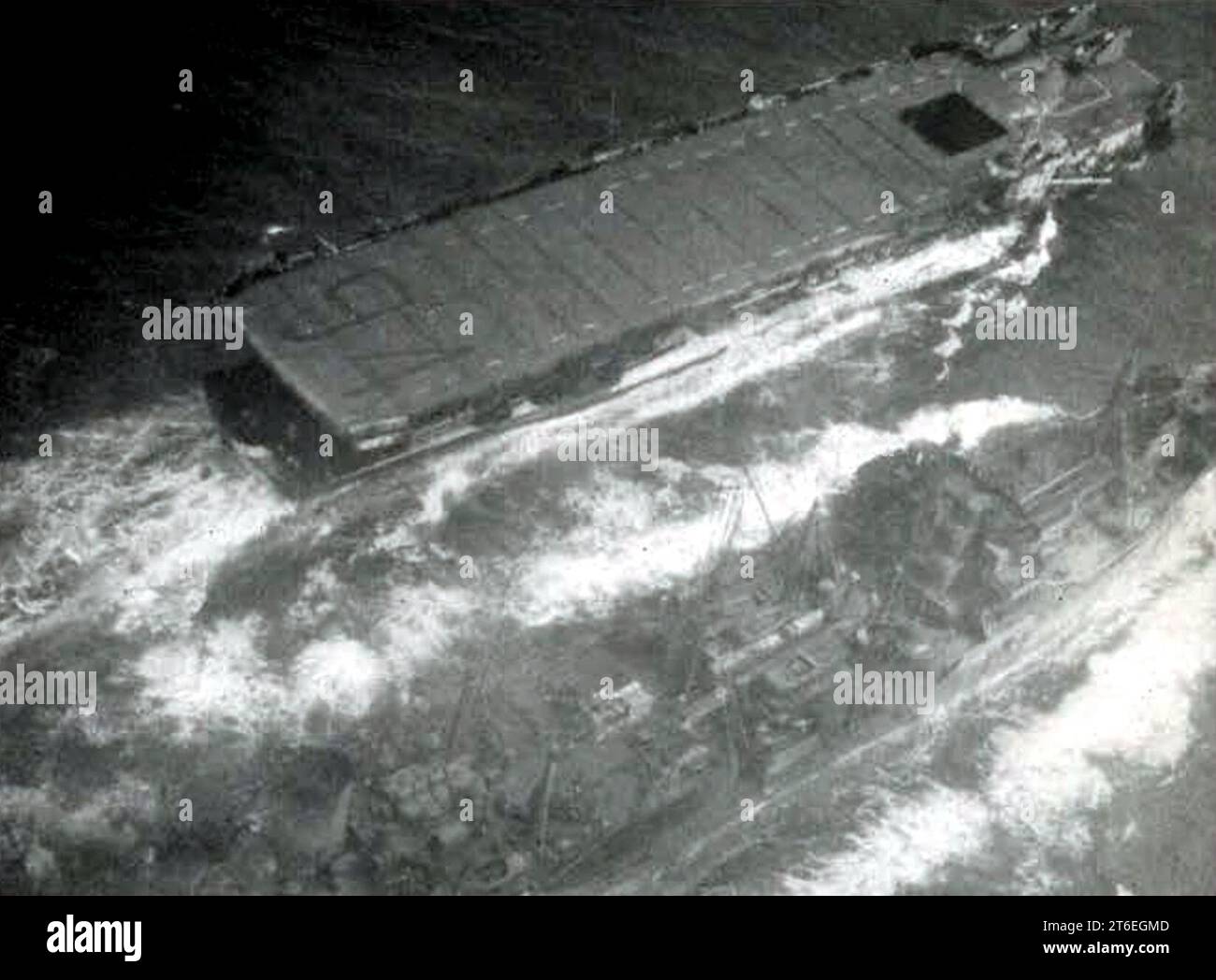 USS Lunga Point (CVE-94) pulls away from a tanker after refueling off ...