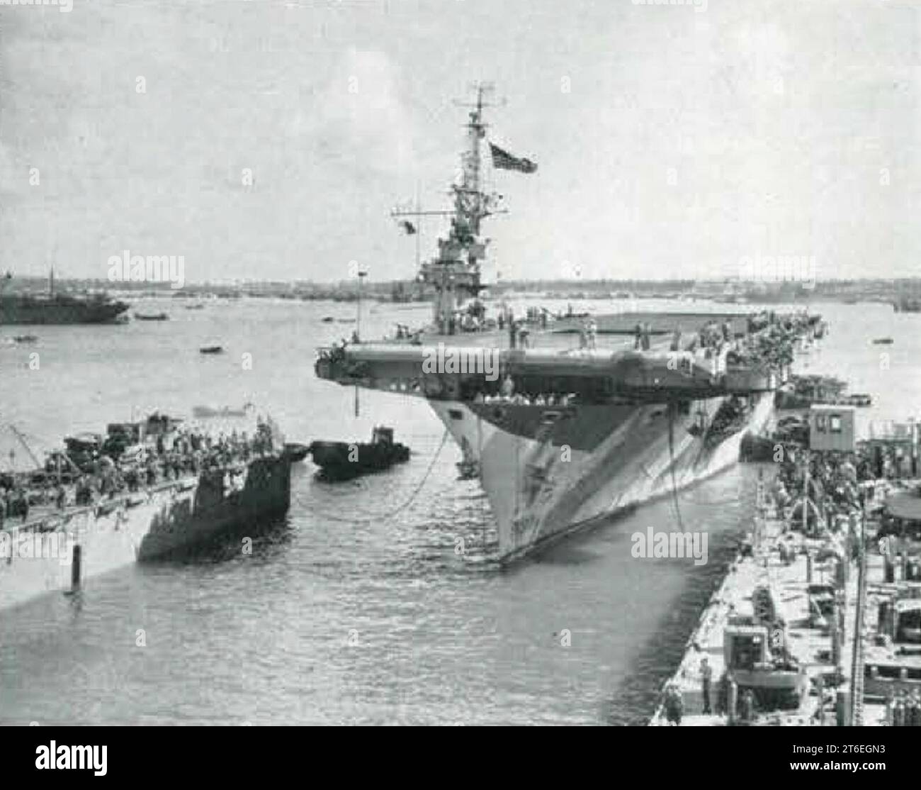 USS Lunga Point (CVE-94) enters a floating drydock at Guam, in May 1945 ...
