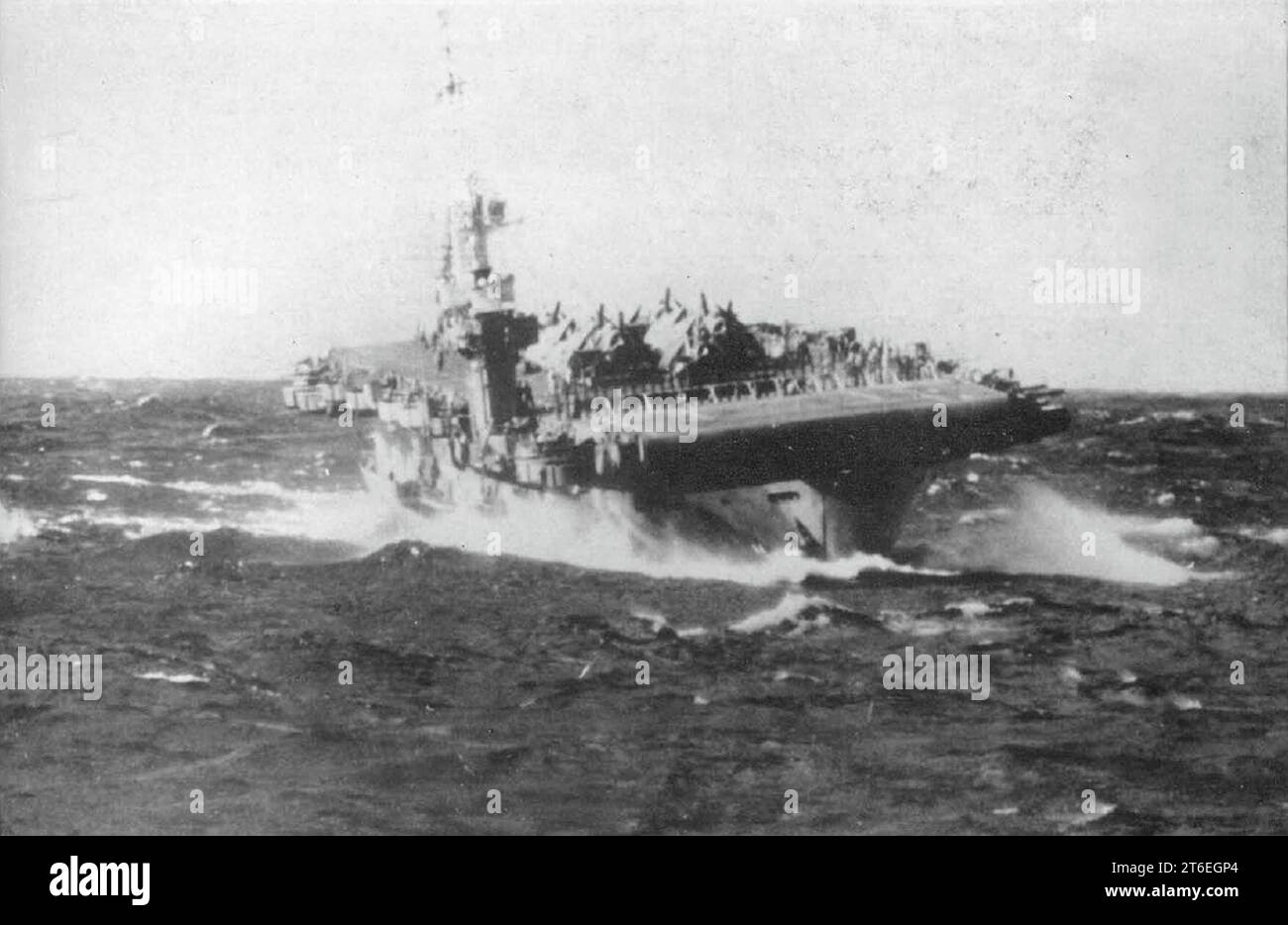 USS Lunga Point (CVE-94) rolling and pitching in heavy seas, in October ...