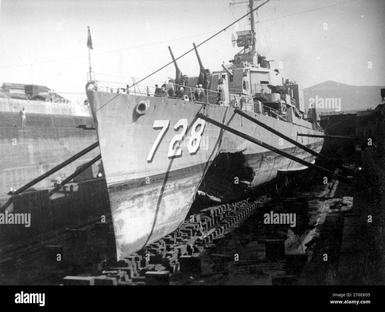 USS Mansfield (DD-728) drydocked at Sasebo, Japan, after striking a ...