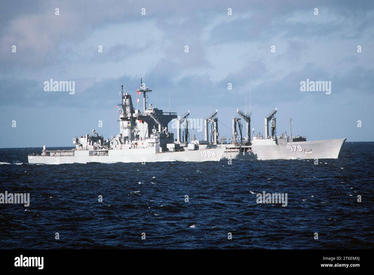 USS Merrimack (AO-179) refueling USS Pharris (FF-1094) during BALTOPS ...
