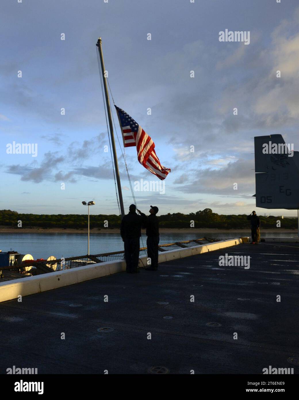 USS Mesa Verde sailors raise the American flag 140224 Stock Photo - Alamy