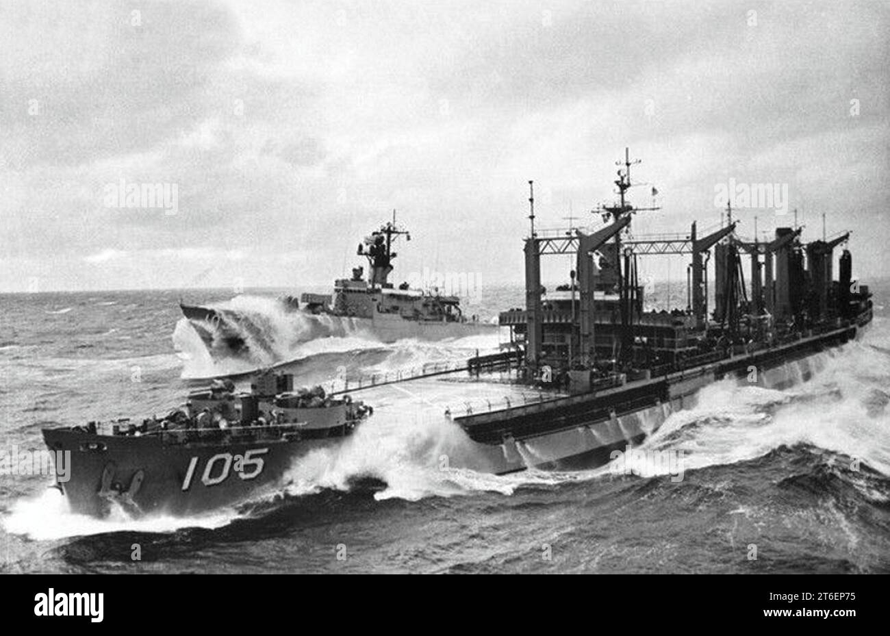 USS Mispillion (AO-105) and USS Bronstein (DE-1037) underway in heavy ...